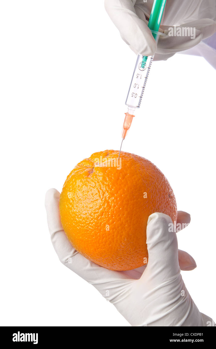 Science experiment with orange and syringe Stock Photo - Alamy