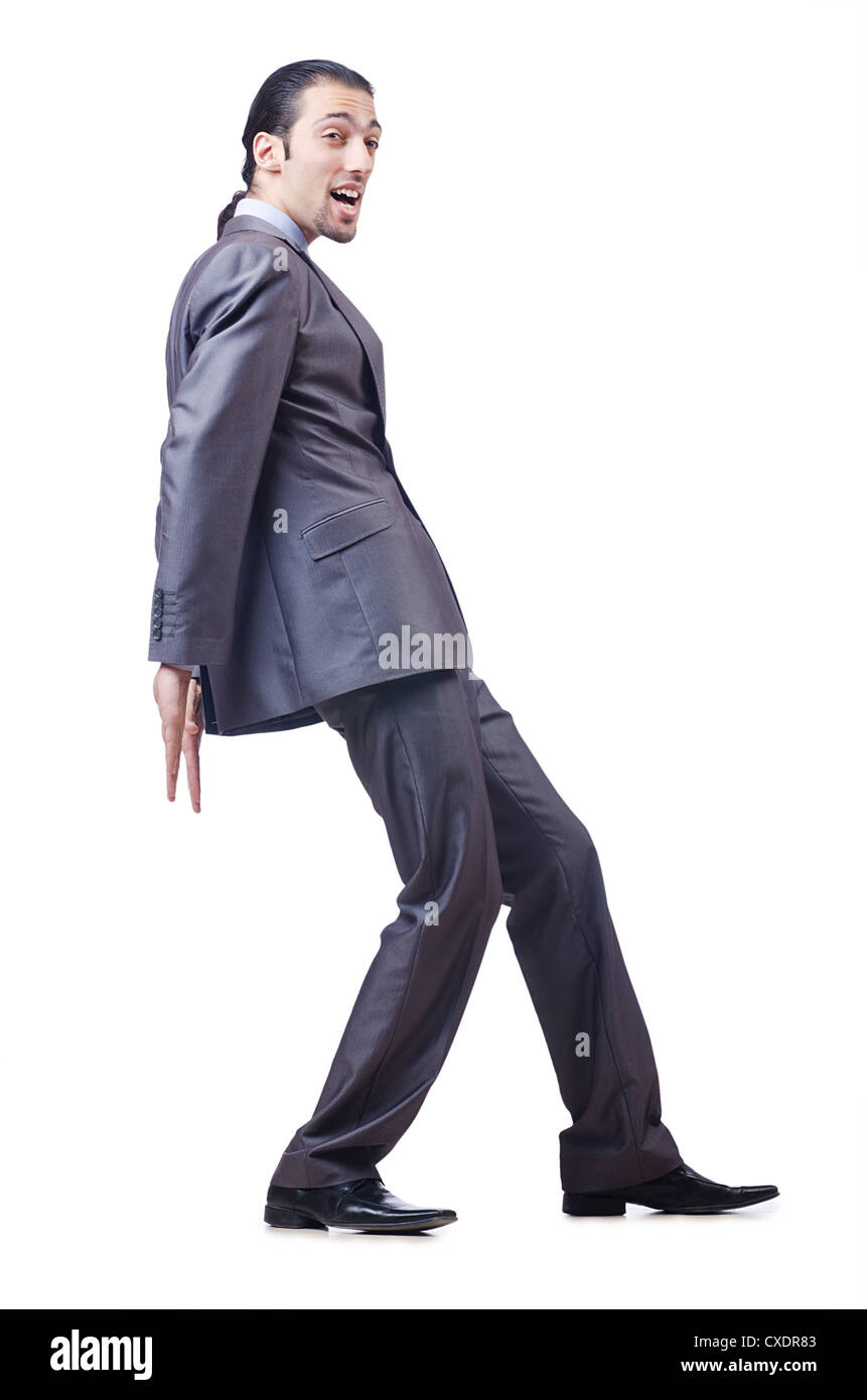 Young businessman pushing invisible obstacles Stock Photo - Alamy