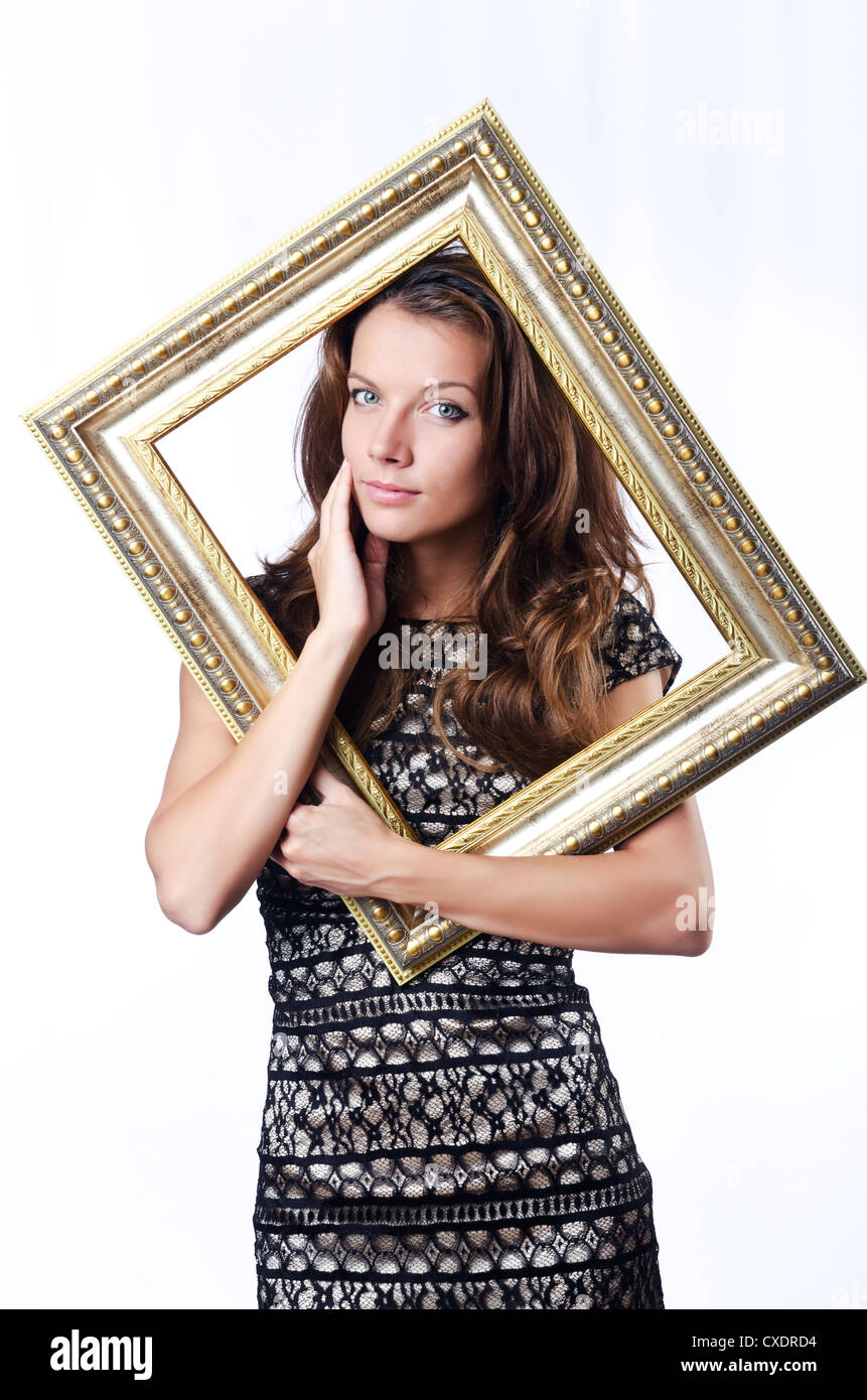 Young woman with picture frame on white Stock Photo - Alamy