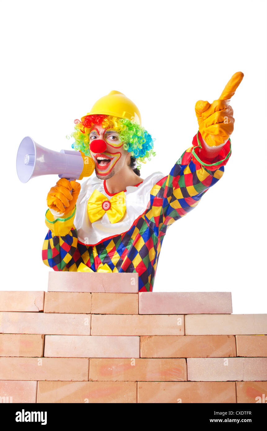 Bad construction concept with clown laying bricks Stock Photo - Alamy