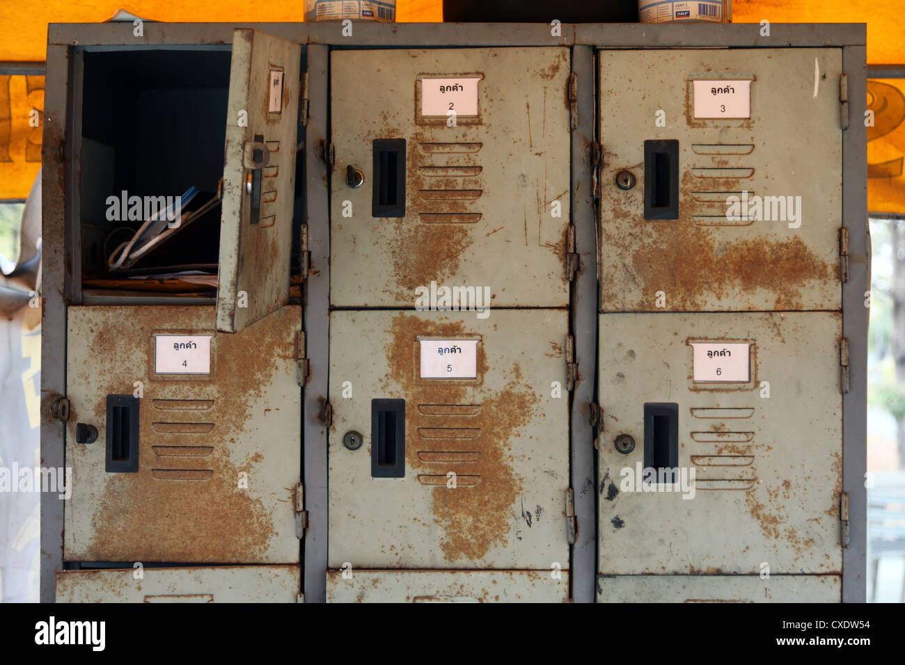 It's a photo of some 9 or nine old lockers completely rusted and ...