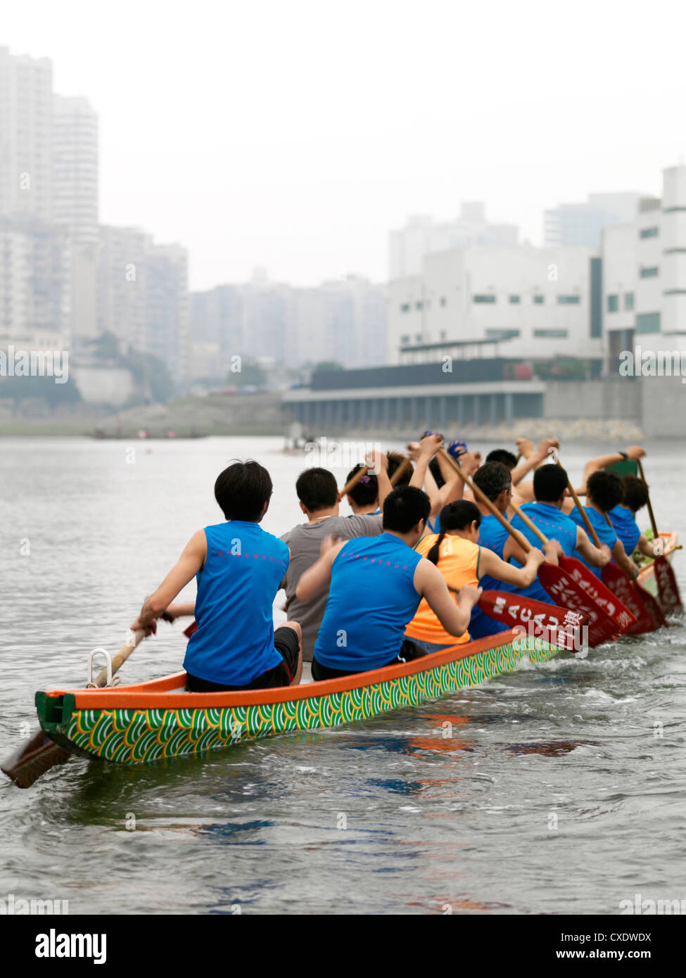 Dragon Boat Racers practice back and forth across the Nam Van Lake in ...