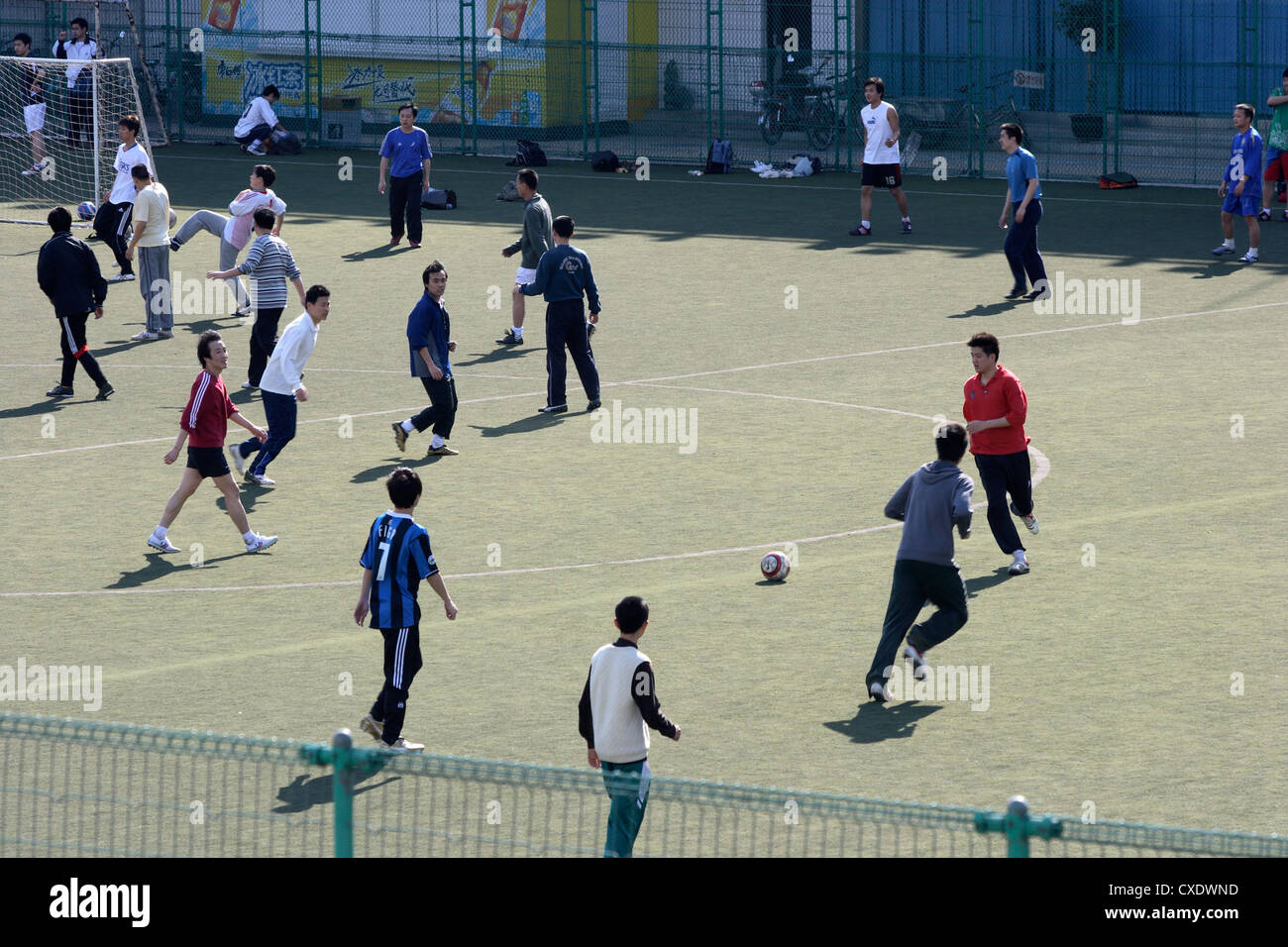 Beijing, Chinese youth playing football Stock Photo - Alamy