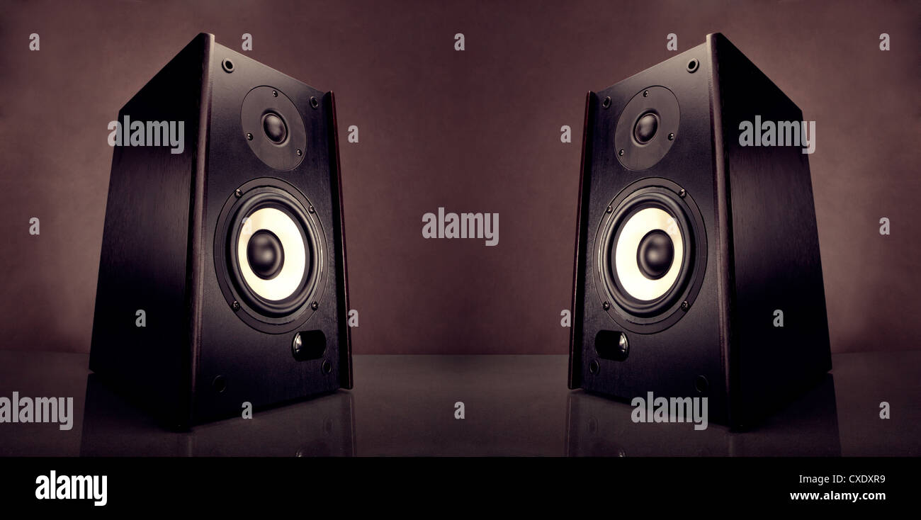 Two energy audio speakers on a brown background Stock Photo - Alamy