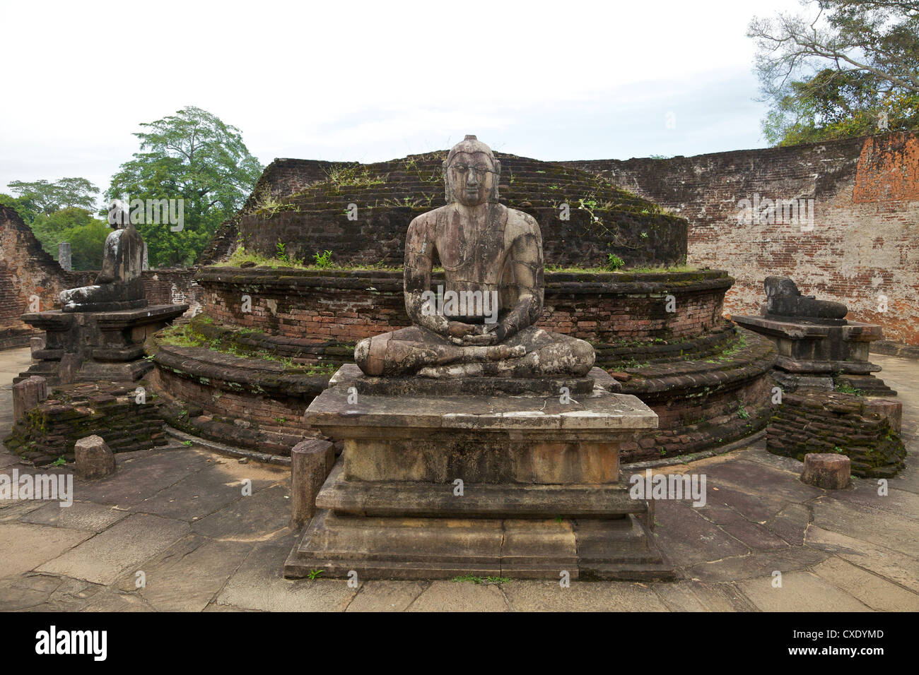 One of the Buddha statues on the upper platform, next to the stupa ...