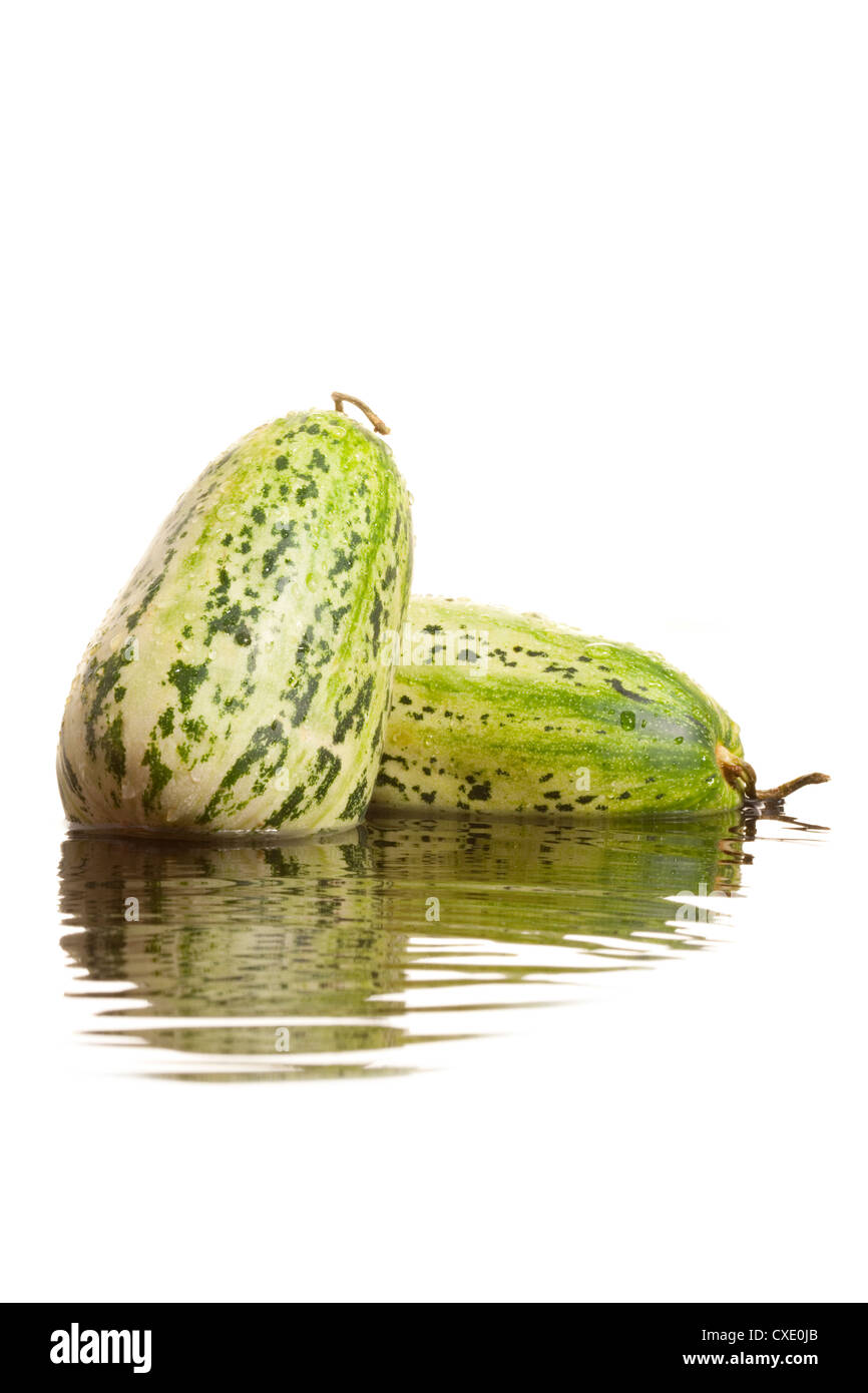 Sweet melons with reflection on rippling water surface Stock Photo - Alamy