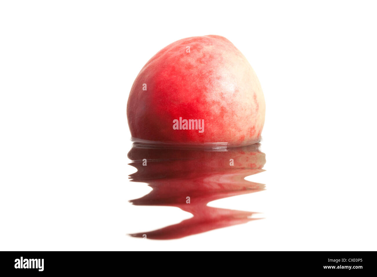 Peach in rippling water Stock Photo - Alamy