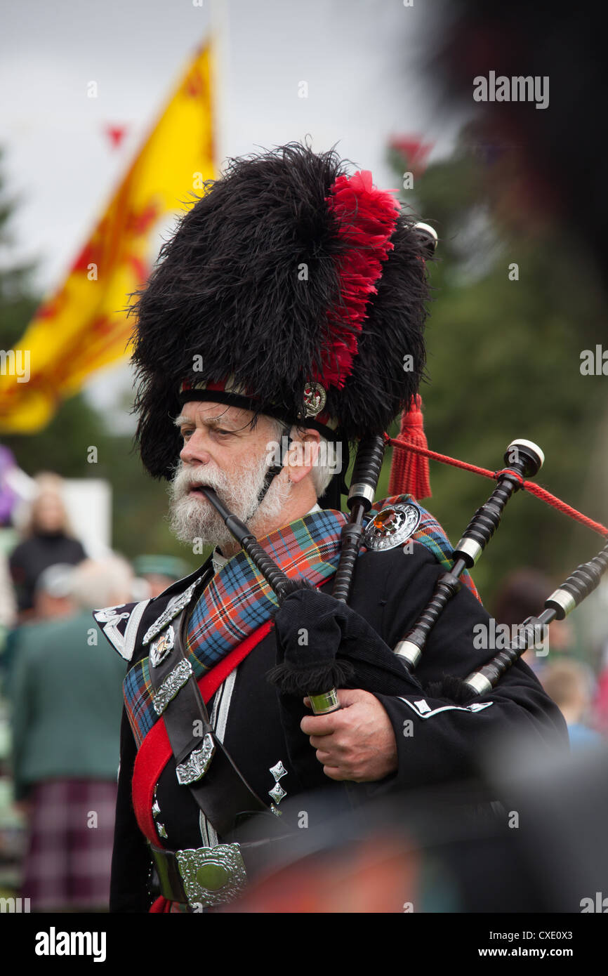 Village of Braemar, Scotland. A Scottish piper at the Royal Braemar ...