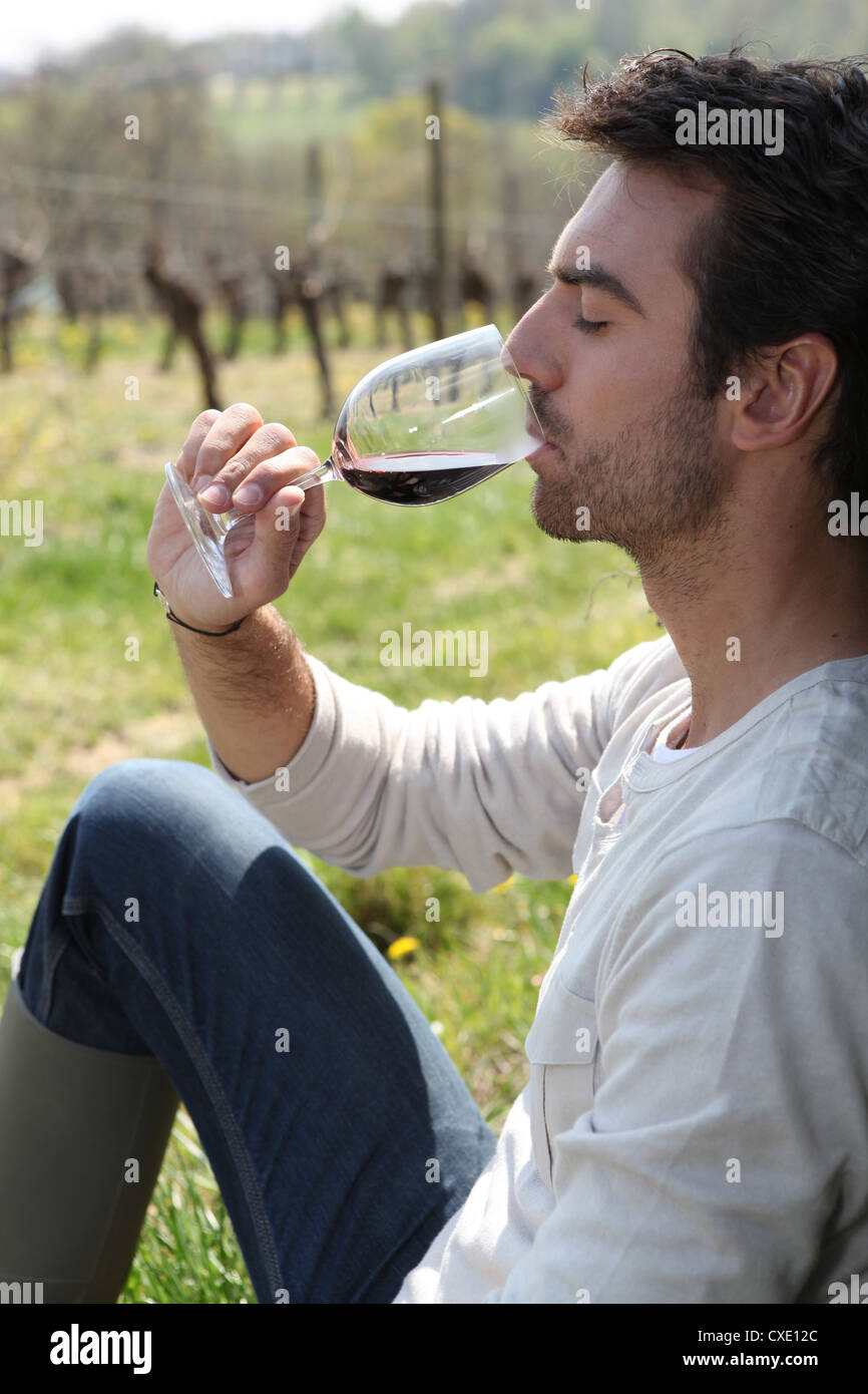 Man sat drinking red wine Stock Photo - Alamy