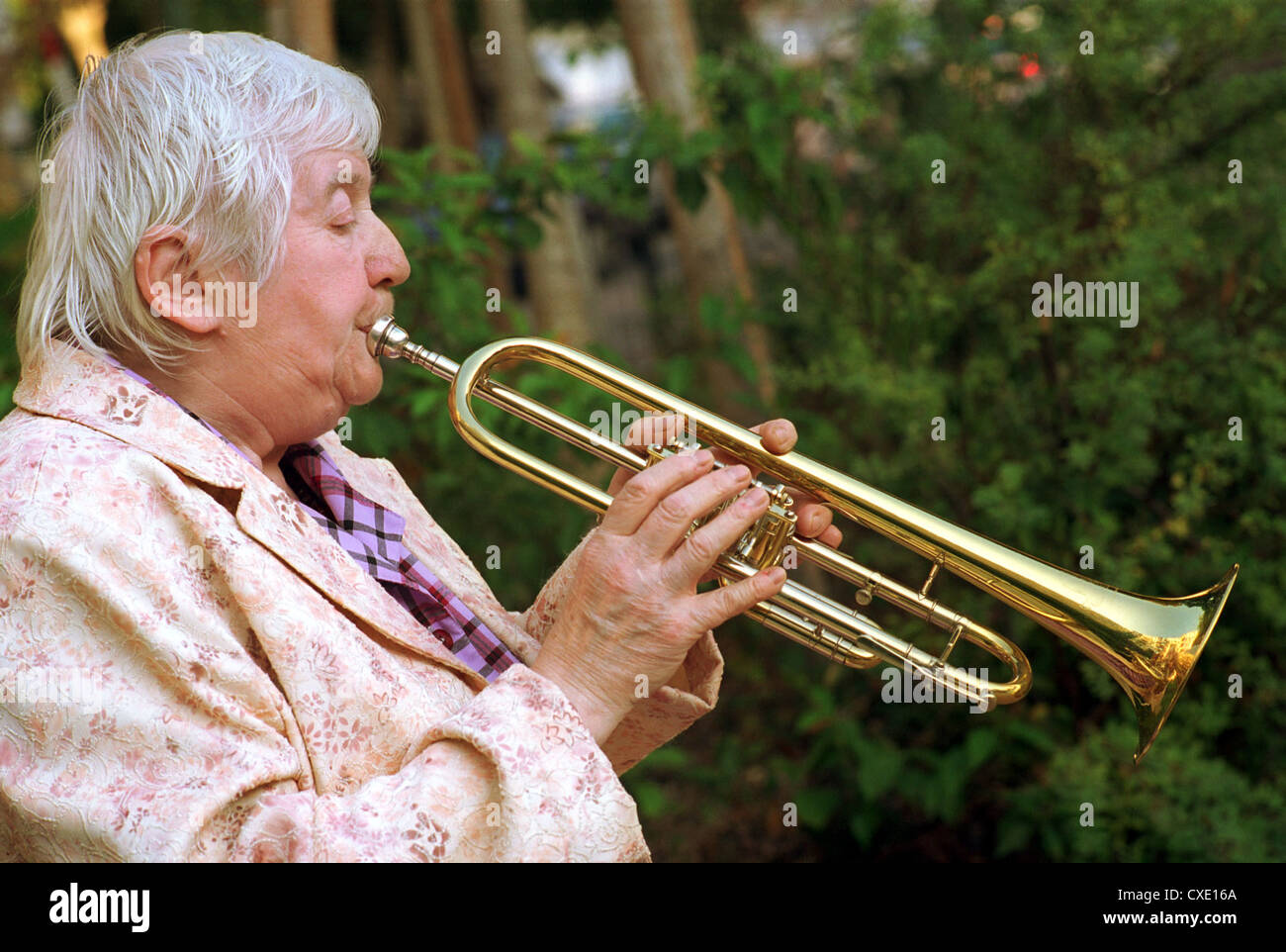 Woman playing trumpet hi-res stock photography and images - Alamy