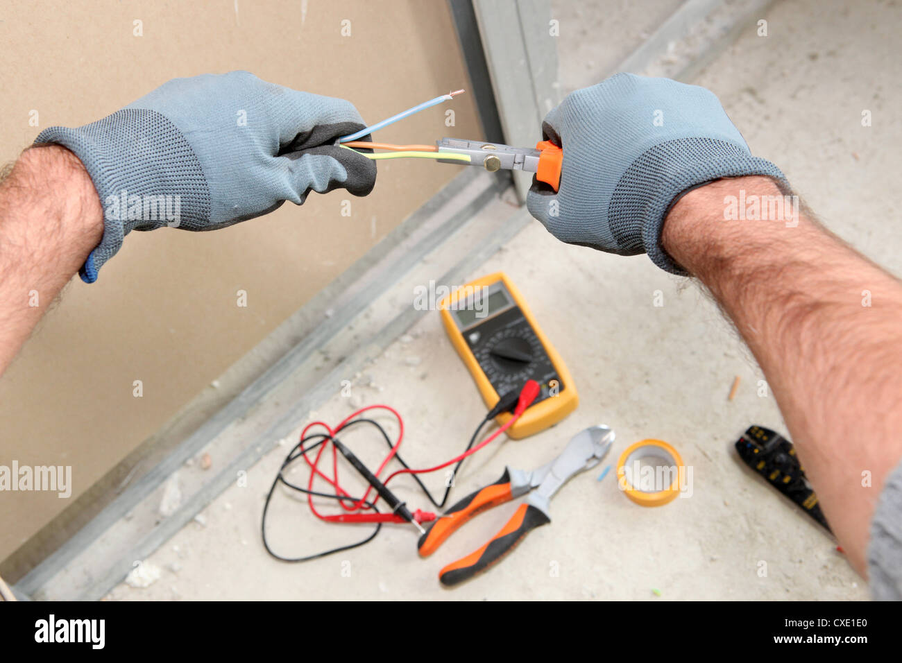 Electrician taking a reading with a voltmeter Stock Photo - Alamy