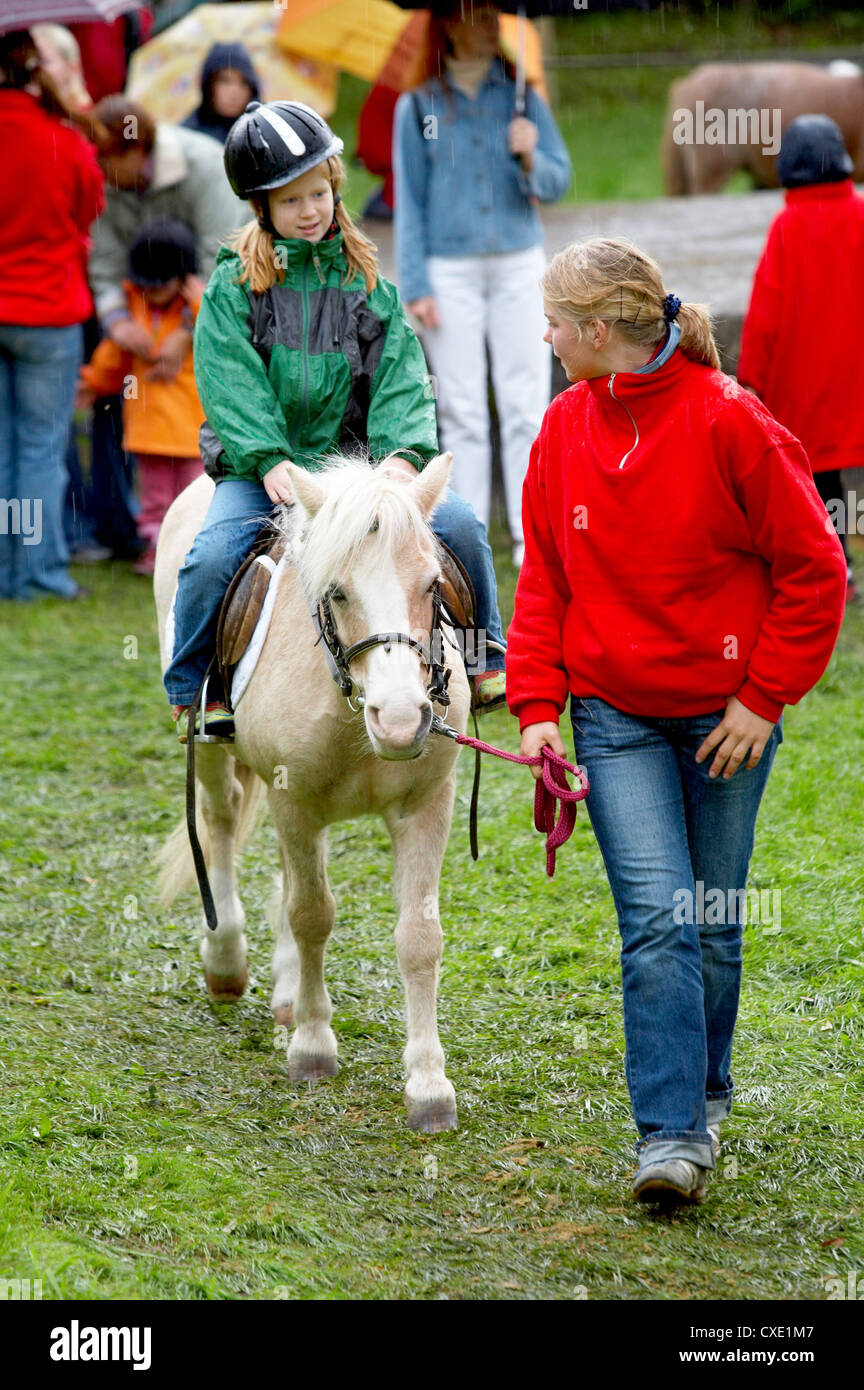Ploen, children and ponies Stock Photo - Alamy