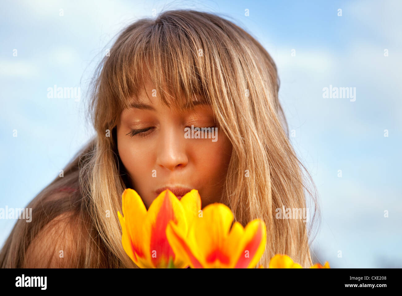 beautiful spring portrait with tulips Stock Photo - Alamy