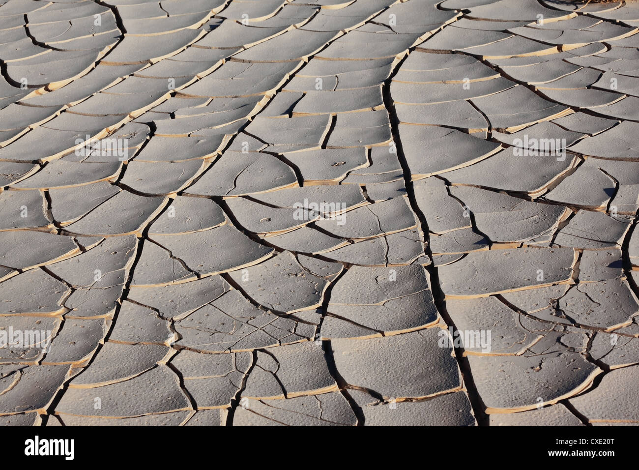 Cold white cracked soil Stock Photo - Alamy