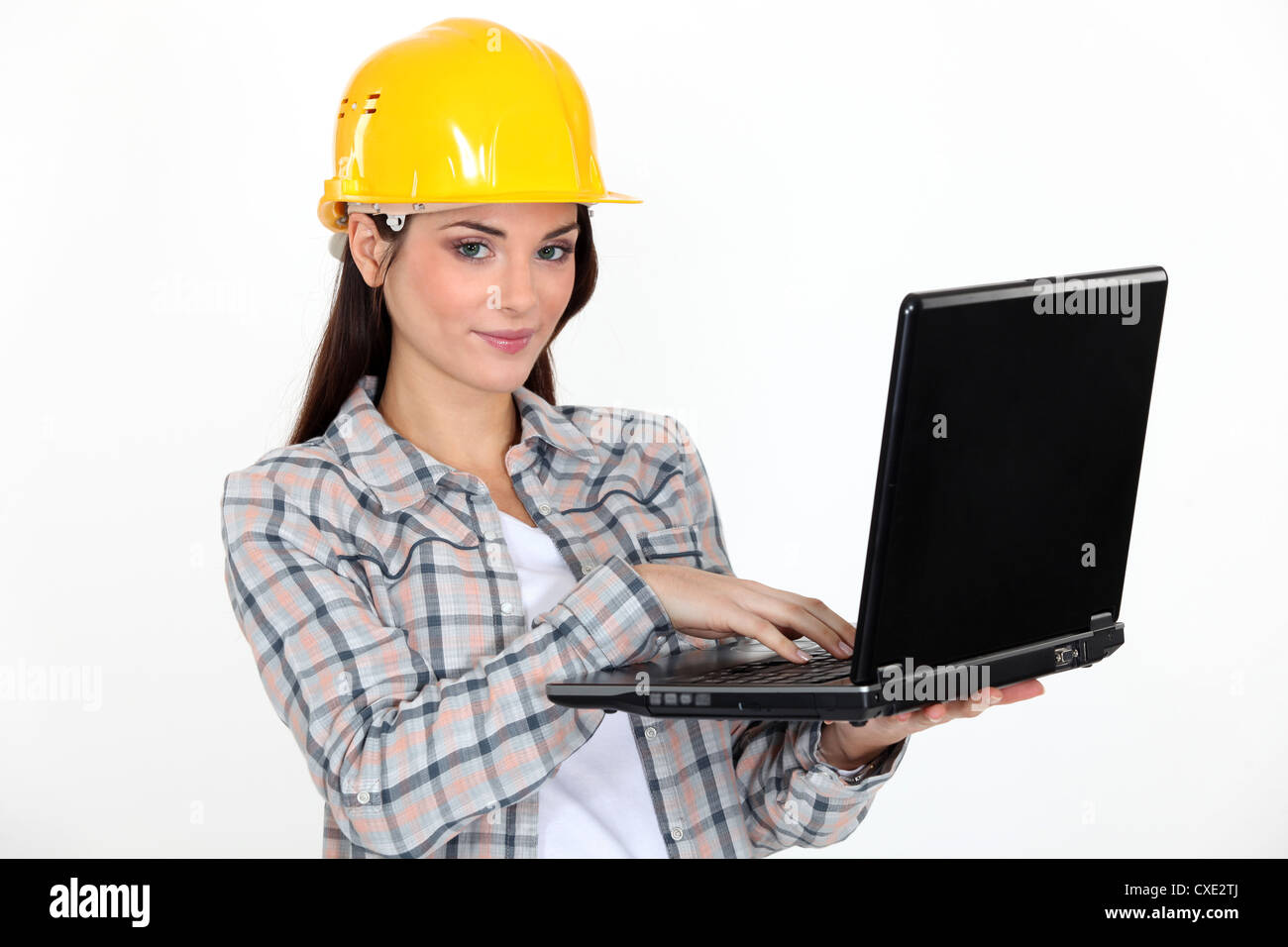 Female construction worker with laptop Stock Photo - Alamy