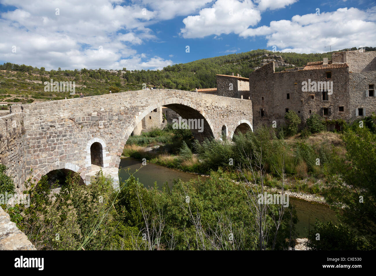 The ancient bridge of Lagrasse and the Orbieu river (Aude - France). Le ...