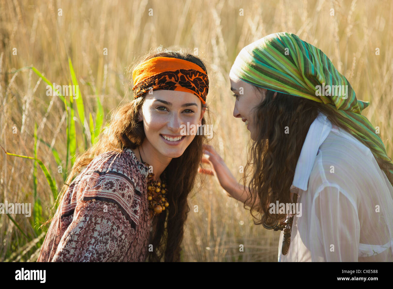 Young women in grass Stock Photo - Alamy