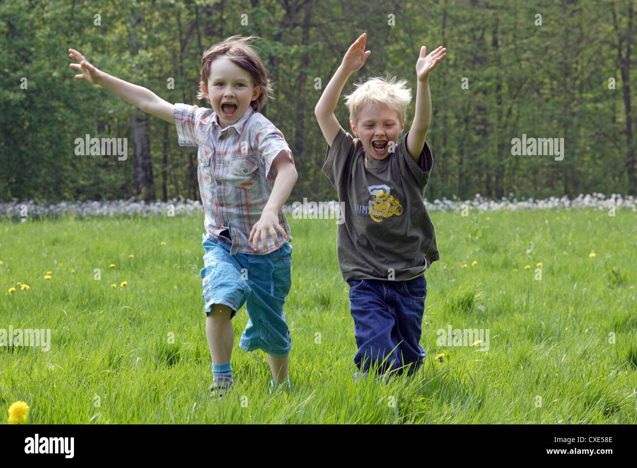 Leipzig, children running over a meadow Stock Photo - Alamy