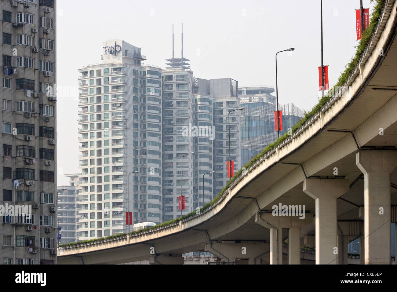 Shanghai high street winds through residential area Stock Photo - Alamy