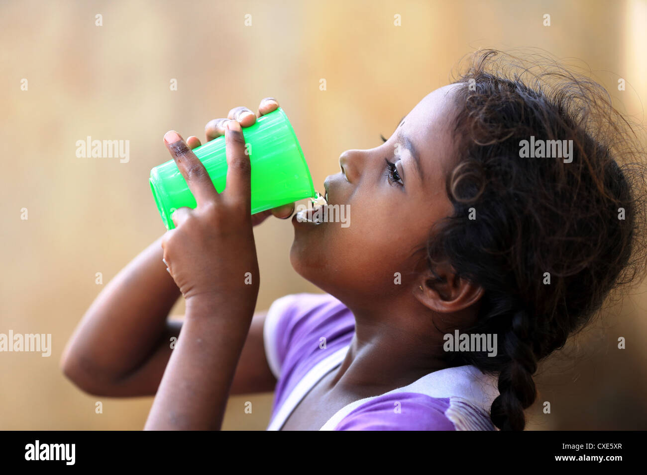 Indian school child drinking water during lunch break Andhra Pradesh ...