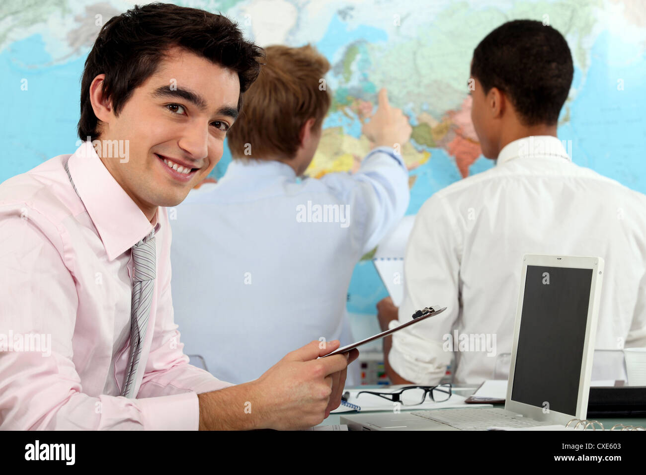 Three students in geography class Stock Photo - Alamy