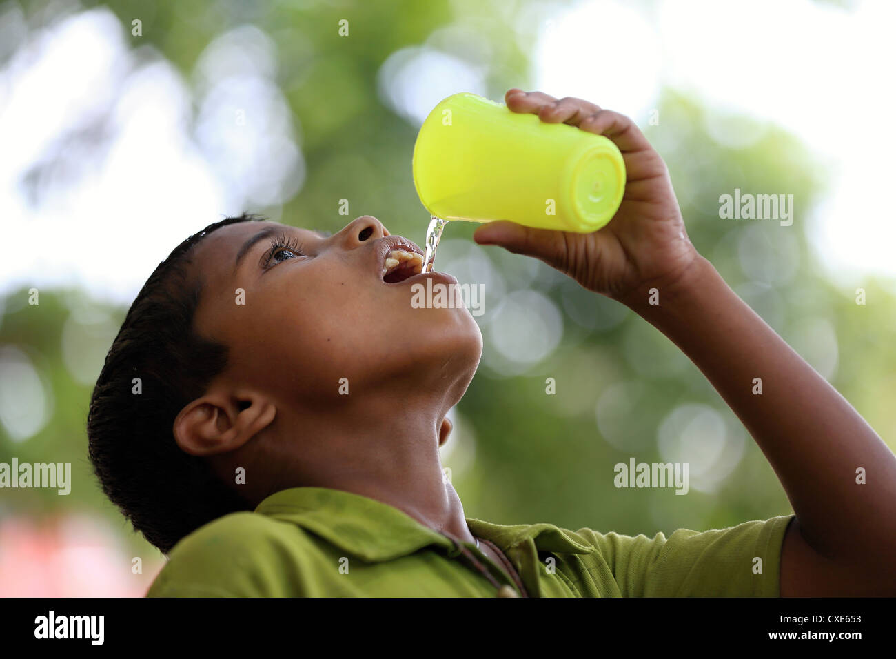 Indian school child drinking water during lunch break Andhra Pradesh ...