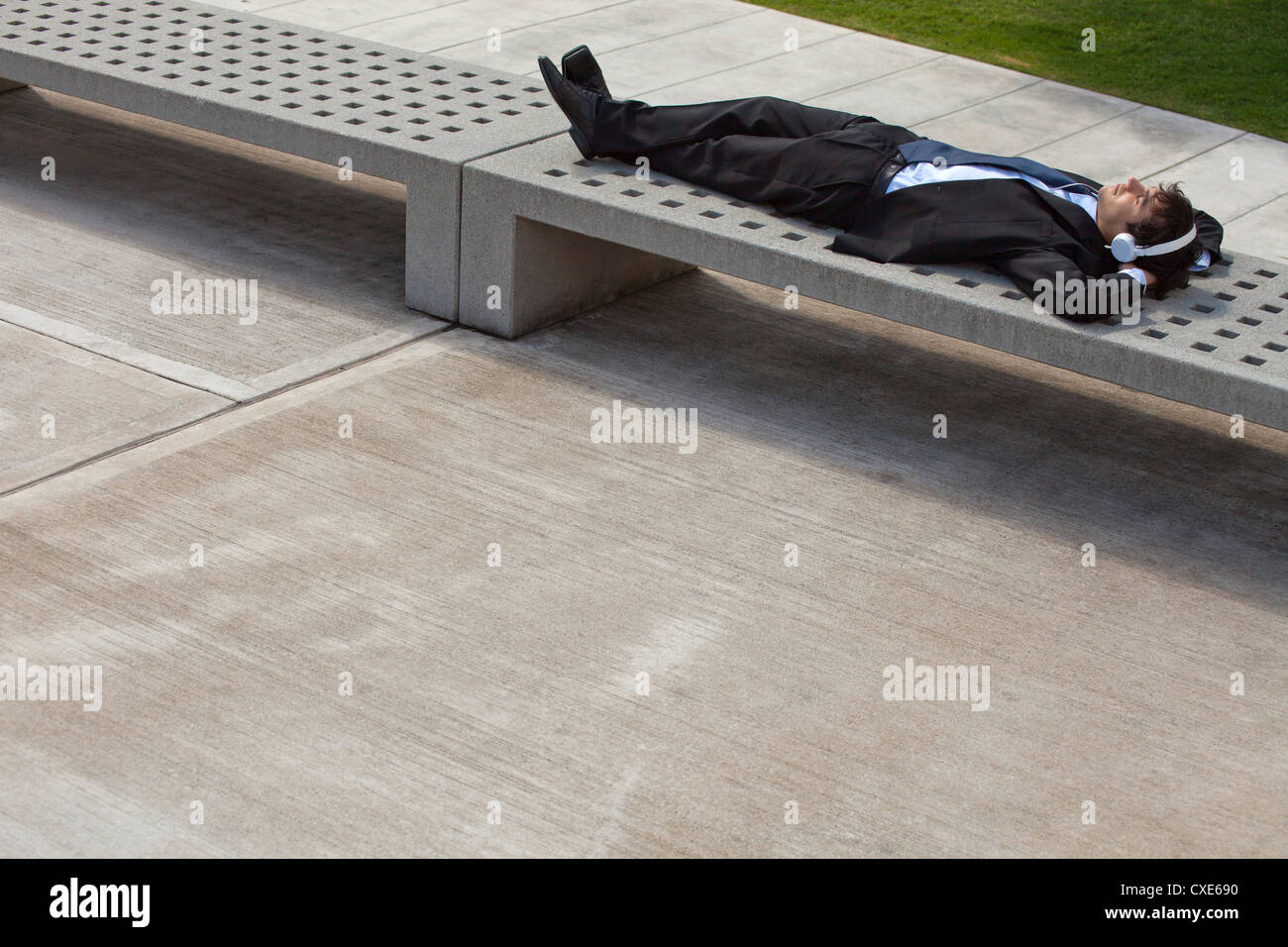 Businessman lying down on bench hi-res stock photography and images - Alamy