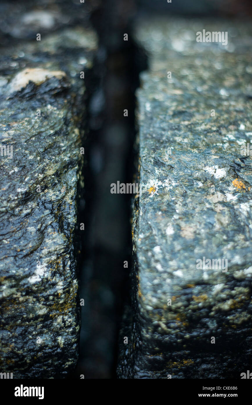 A rock split in two Stock Photo - Alamy