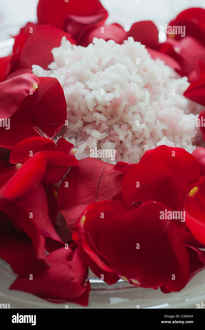 Cooked rice decorated with red rose petals Stock Photo - Alamy