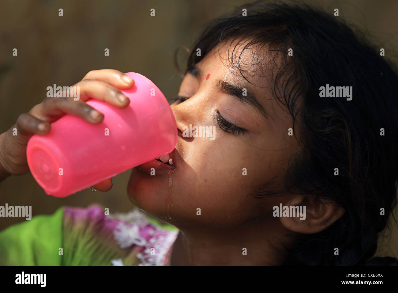 Indian school child drinking water during lunch break Andhra Pradesh ...