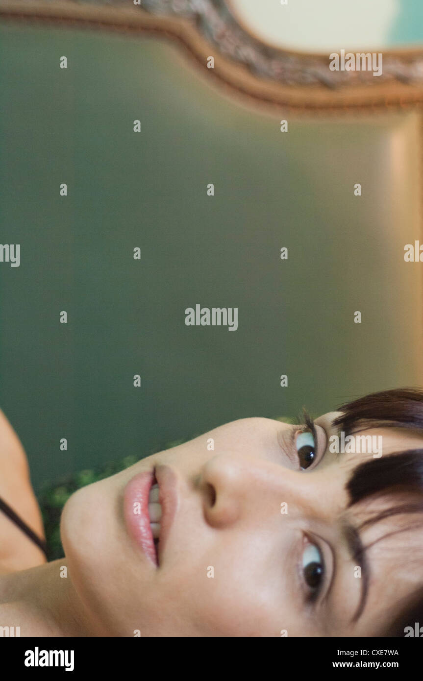 Young woman reclining, portrait Stock Photo - Alamy