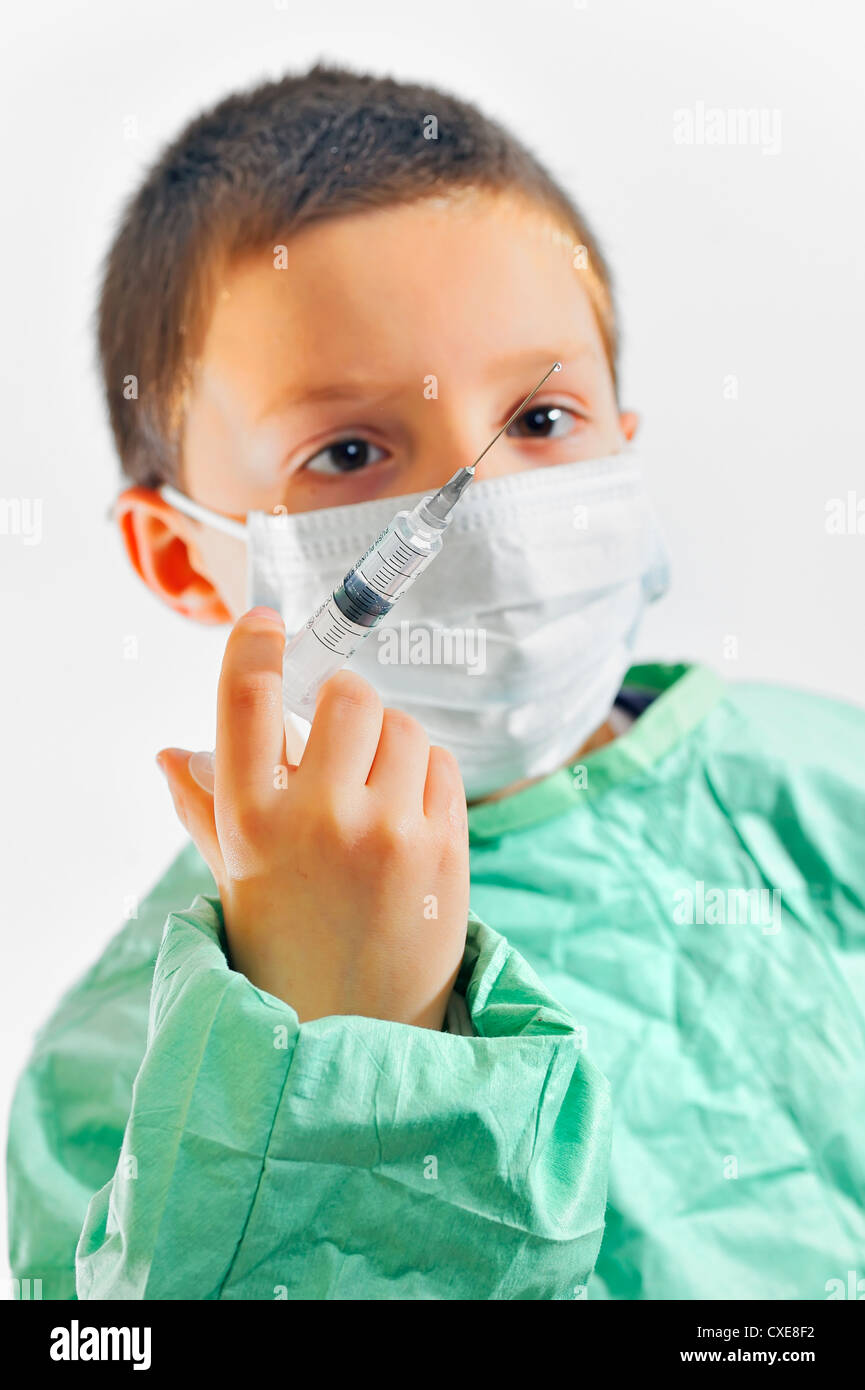 Boy in uniform giving injection Stock Photo - Alamy