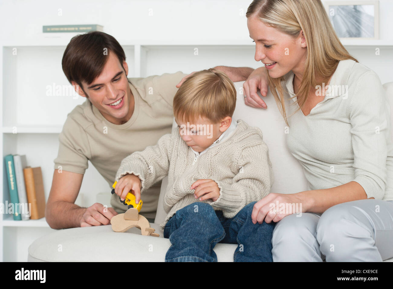 Children toys play adult watching hi-res stock photography and images ...