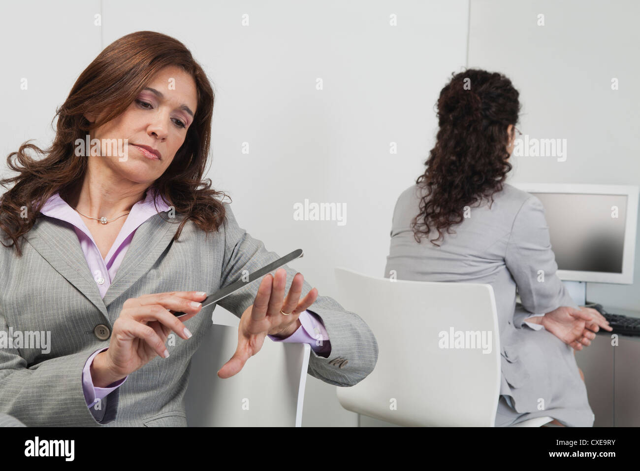 Business woman filing nails office hi-res stock photography and images ...