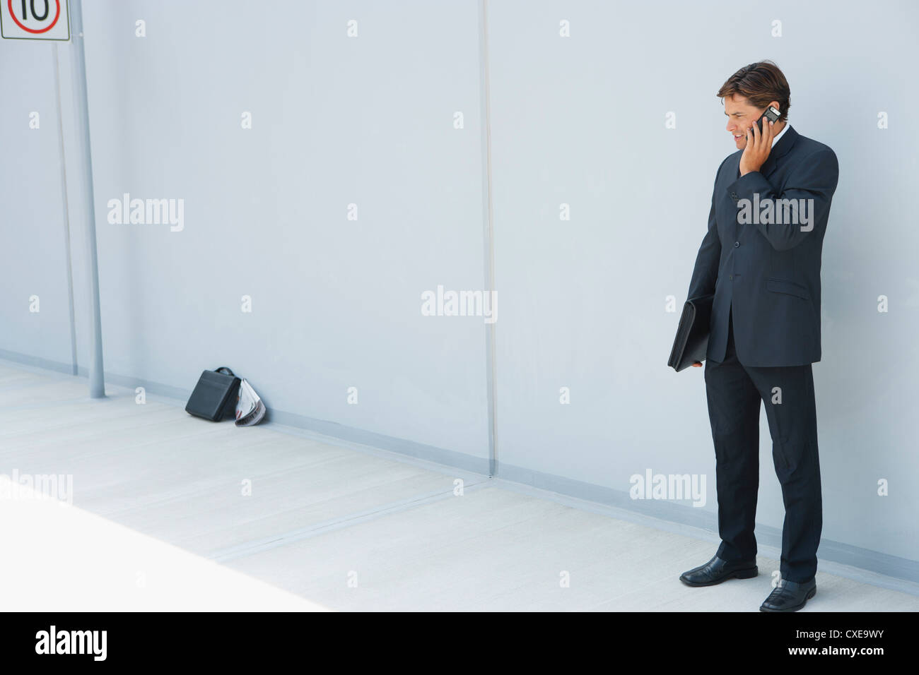 Businessman using cell phone outdoors Stock Photo - Alamy Businessman using cell phone outdoors Stock Photo - Alamy