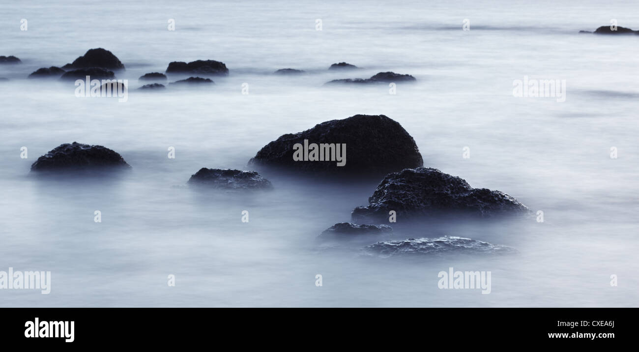 Stones in Surf Stock Photo - Alamy