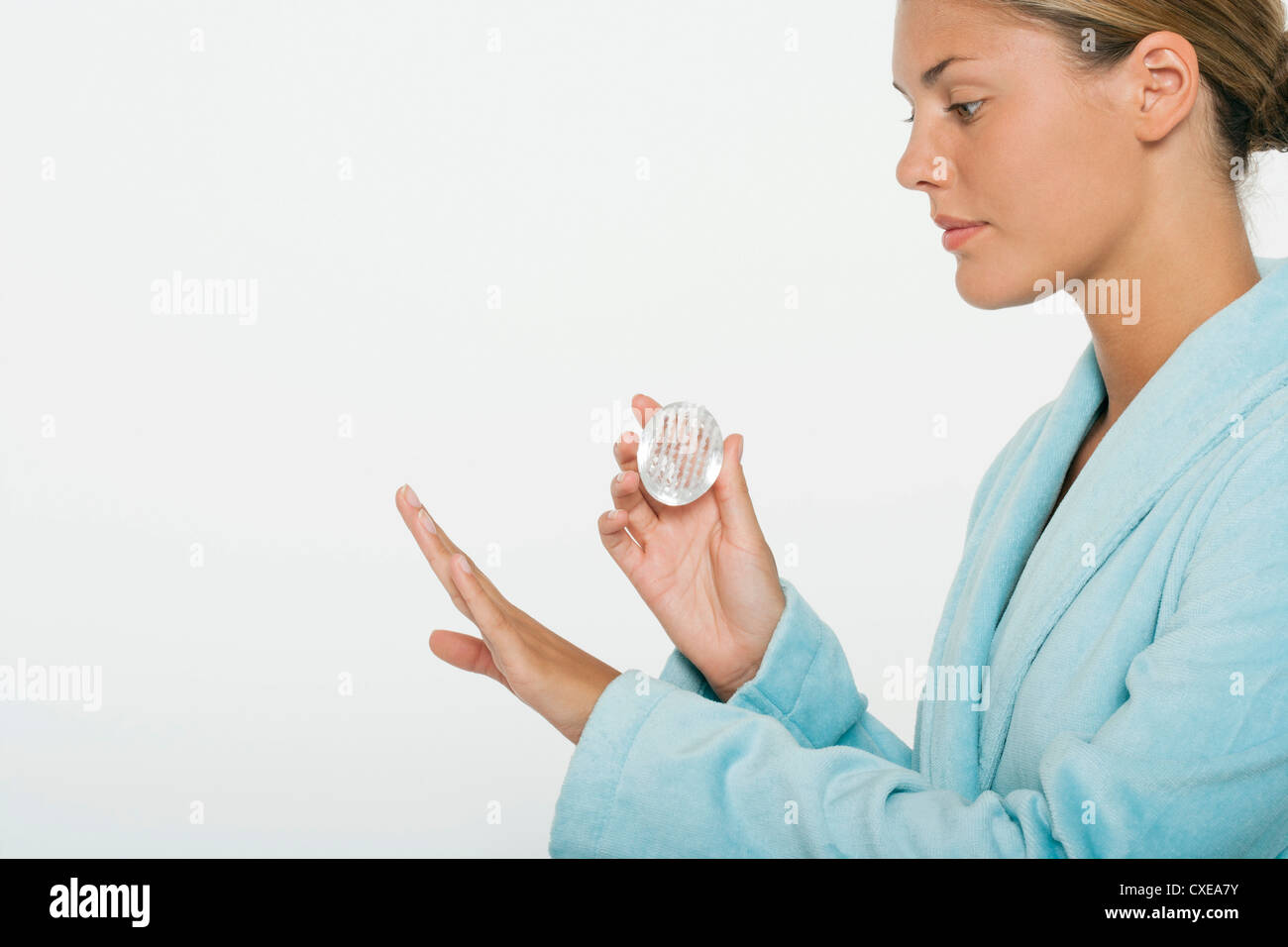 Young woman using nail brush, side view Stock Photo - Alamy