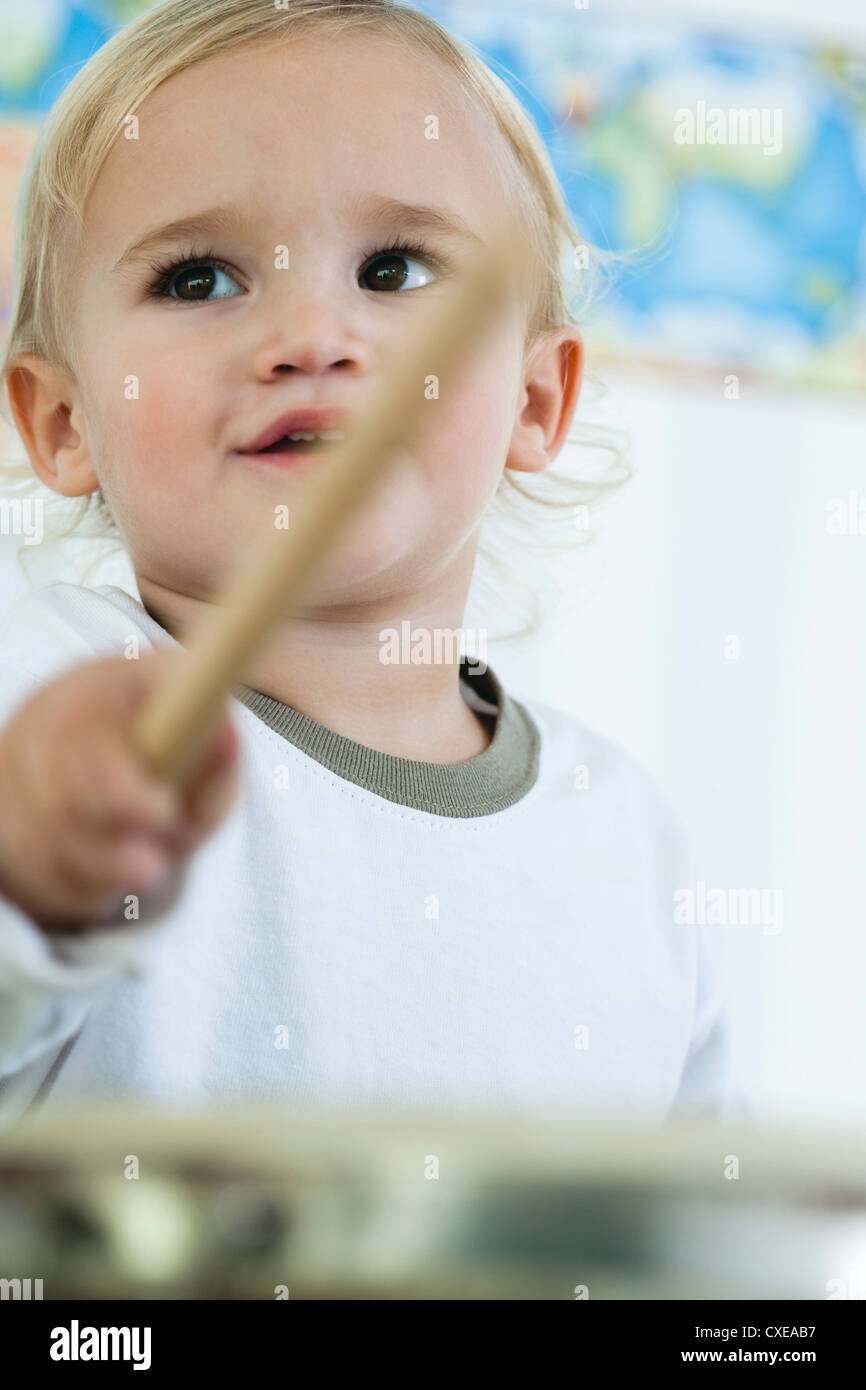 Baby boy playing drum, low angle view Stock Photo - Alamy