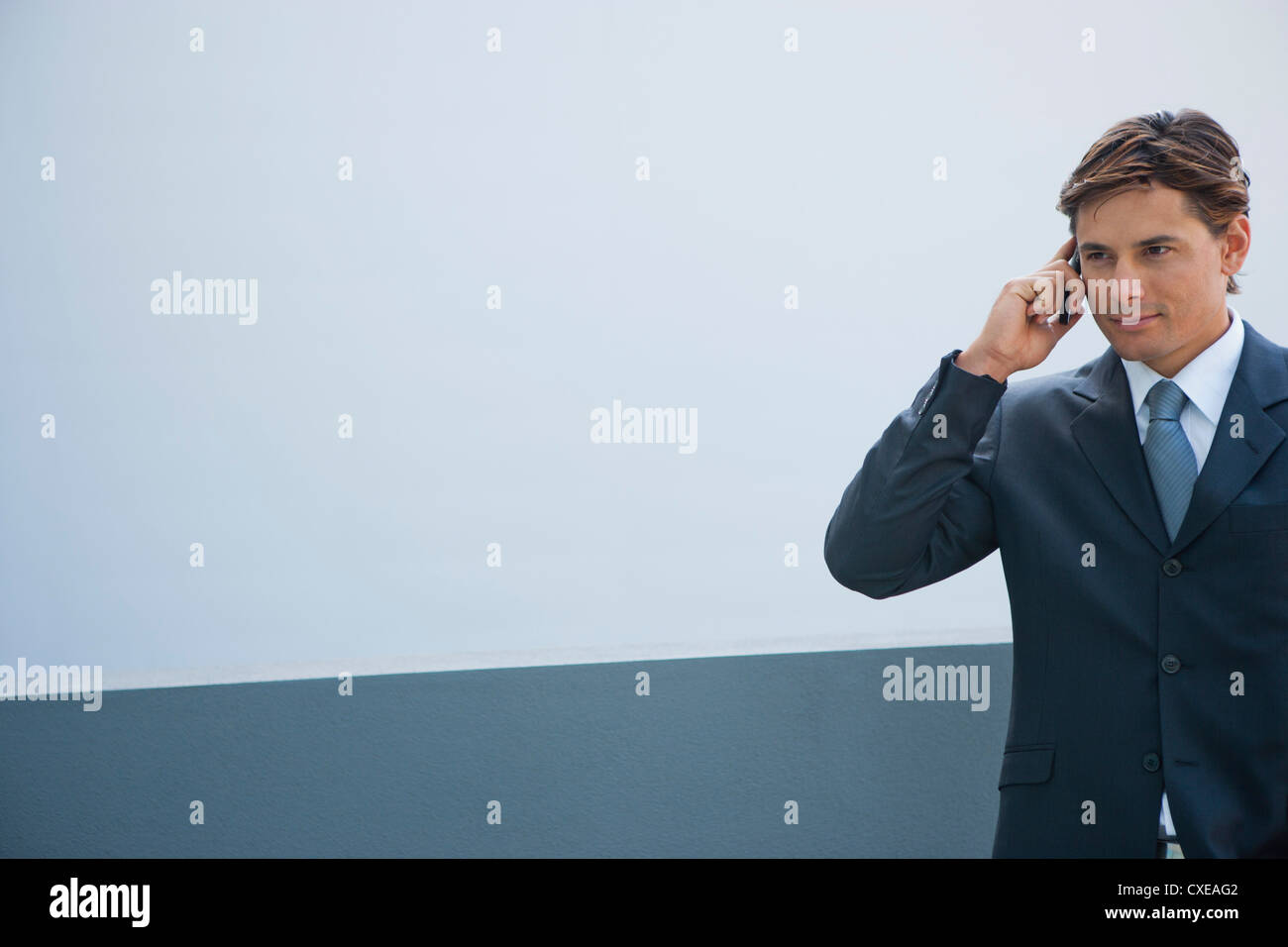 Businessman using cell phone outdoors Stock Photo - Alamy Businessman using cell phone outdoors Stock Photo - Alamy
