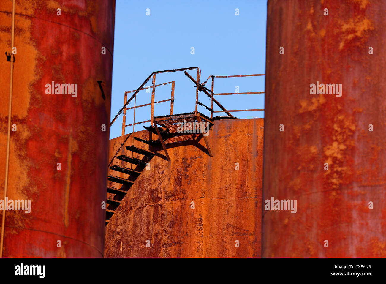 rusted, abandoned oil storage tanks Stock Photo - Alamy