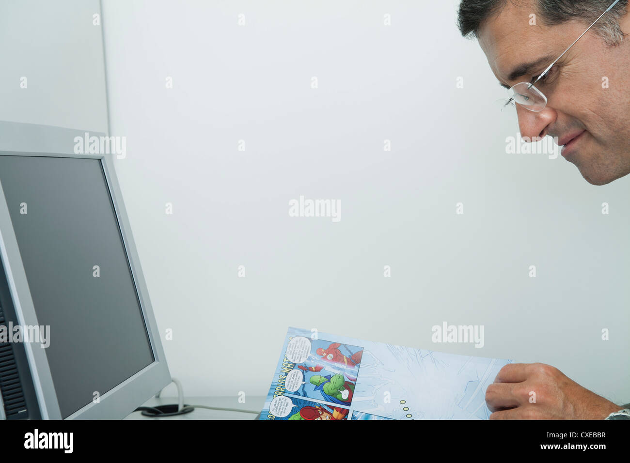 Man holding comic books hi-res stock photography and images - Alamy