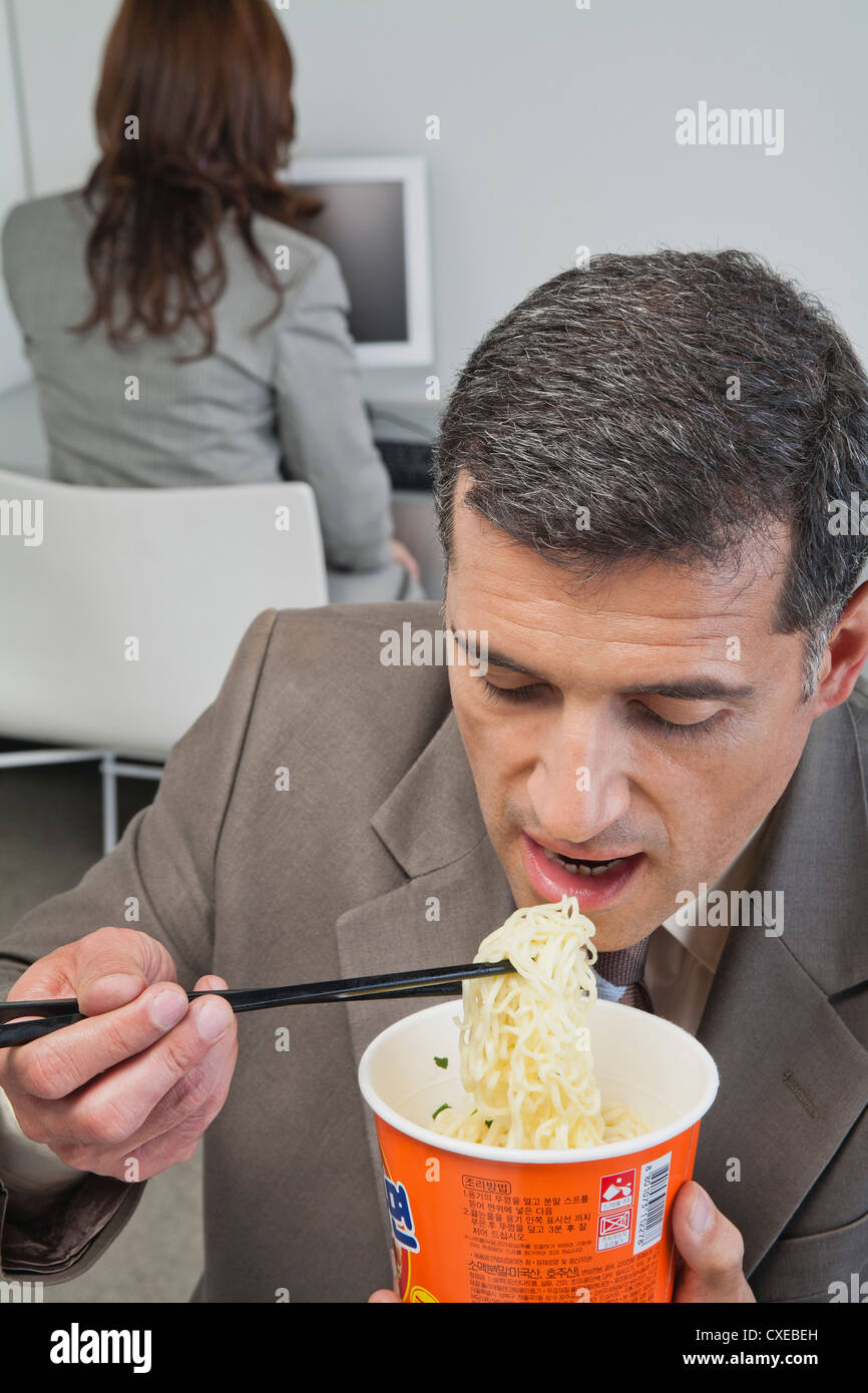 Office workers noodles hi-res stock photography and images - Alamy