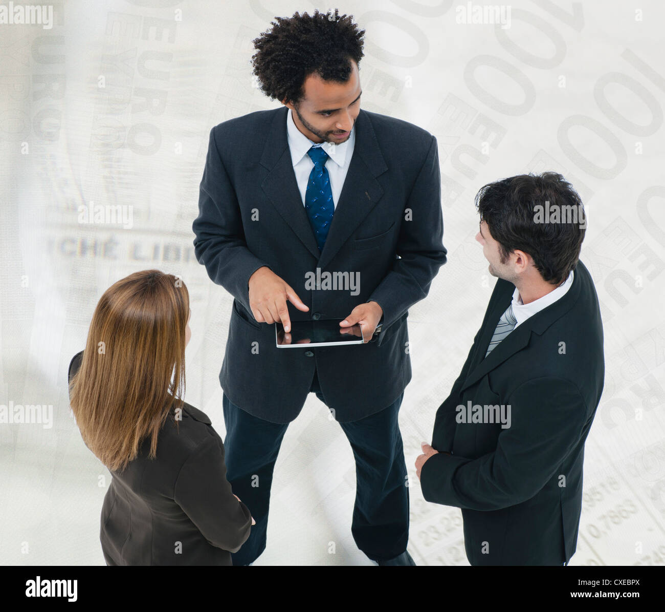 Executives talking together with one-hundred Euro banknotes ...