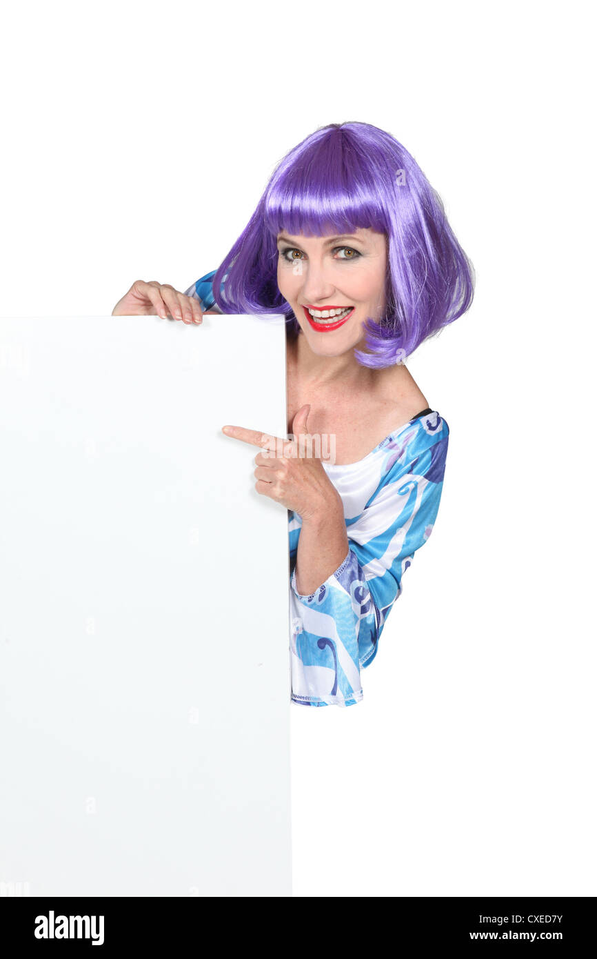 Woman hidden behind wall hi-res stock photography and images - Alamy