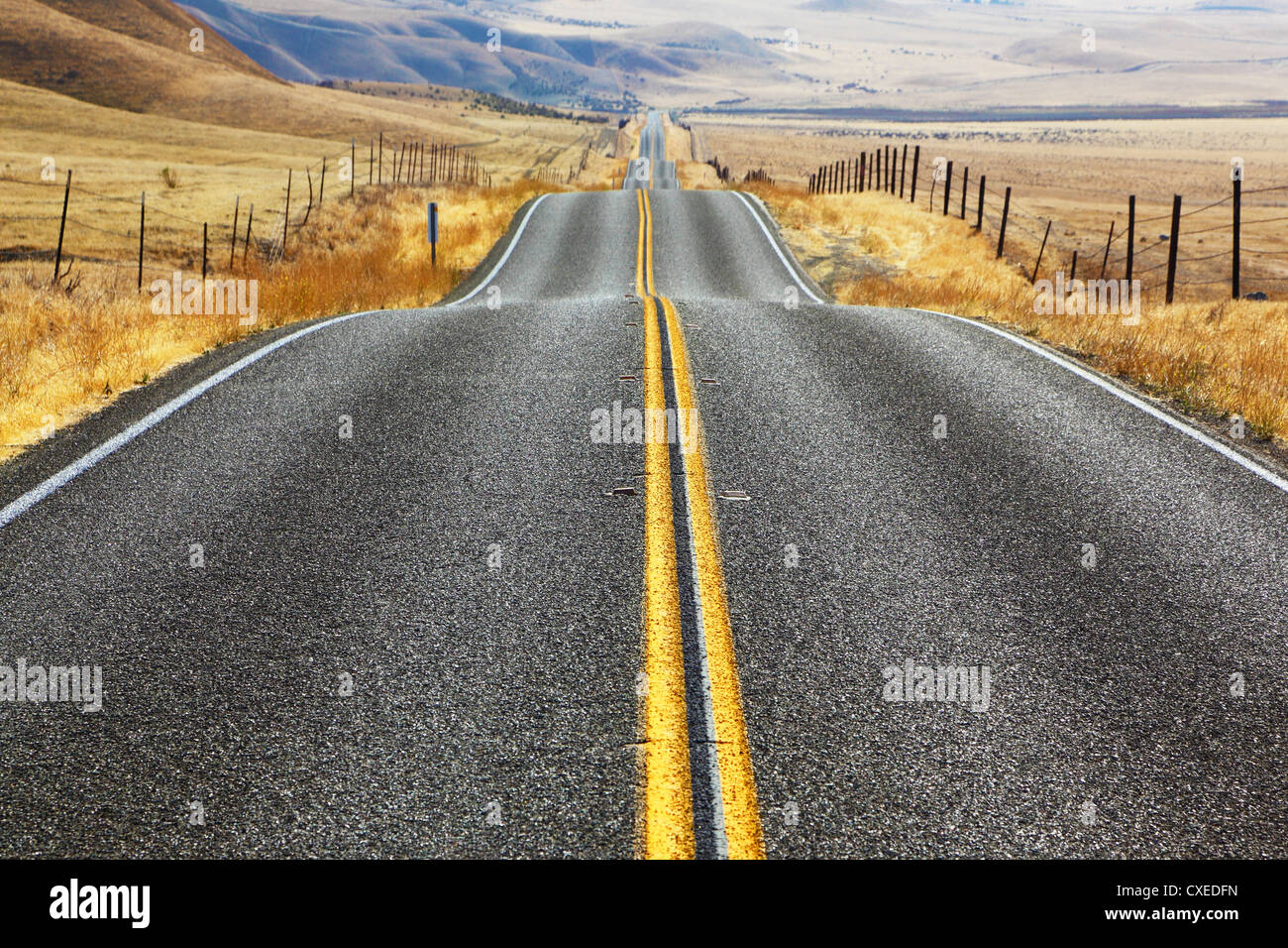 The American road and fencings Stock Photo - Alamy