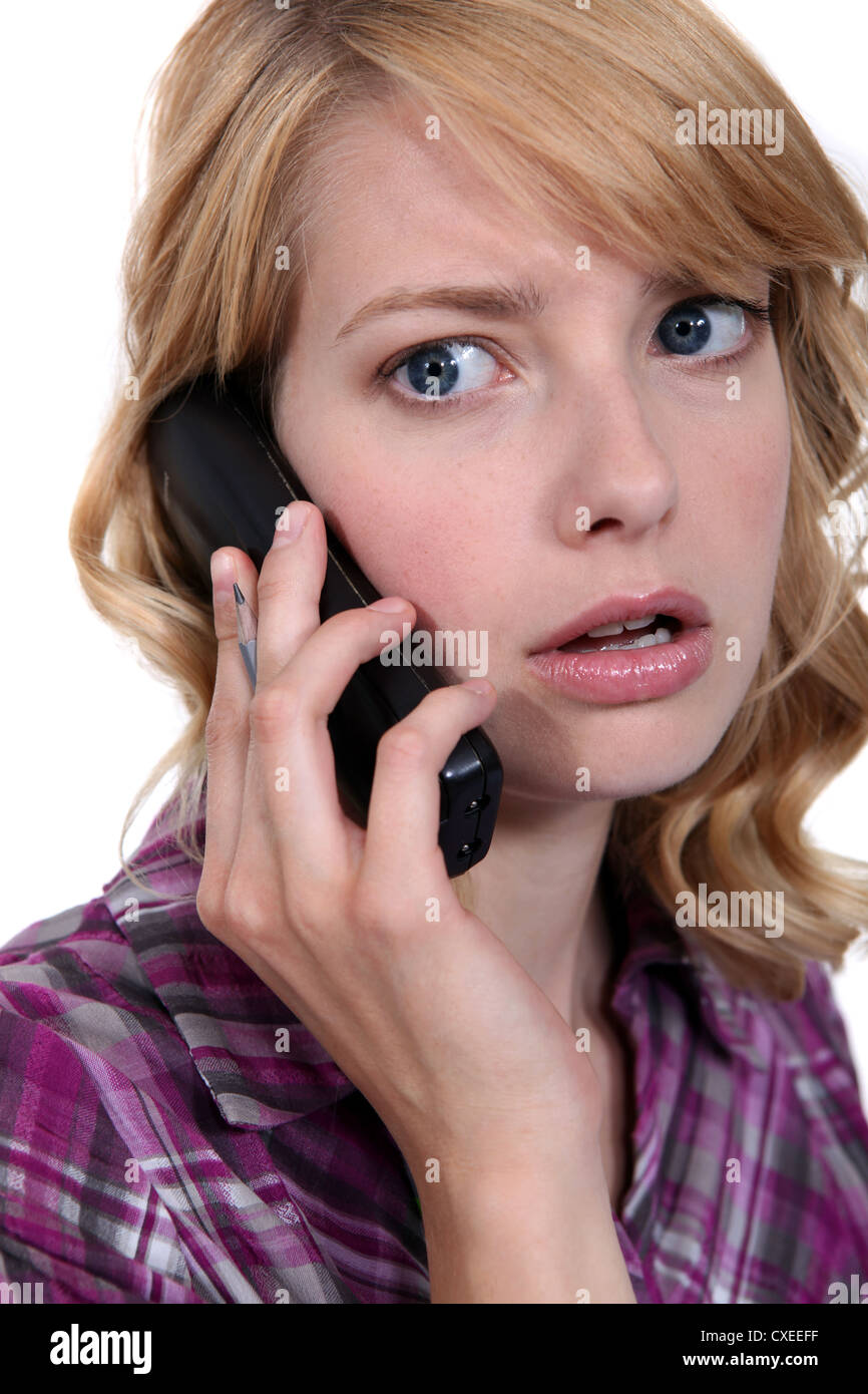 Shocking woman on the telephone Stock Photo - Alamy