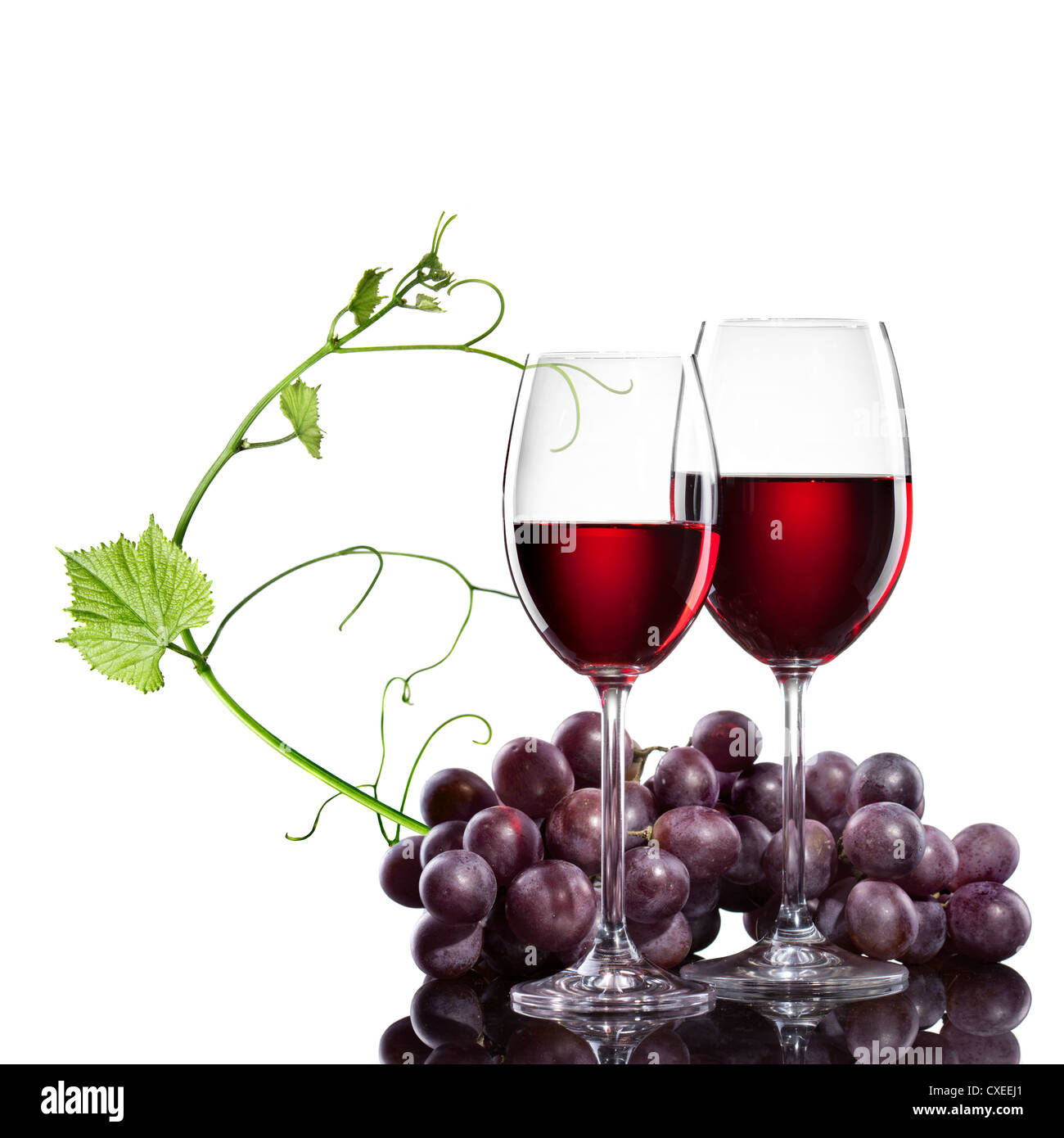 Red wine in glasses with grape and rod isolated on white Stock Photo ...