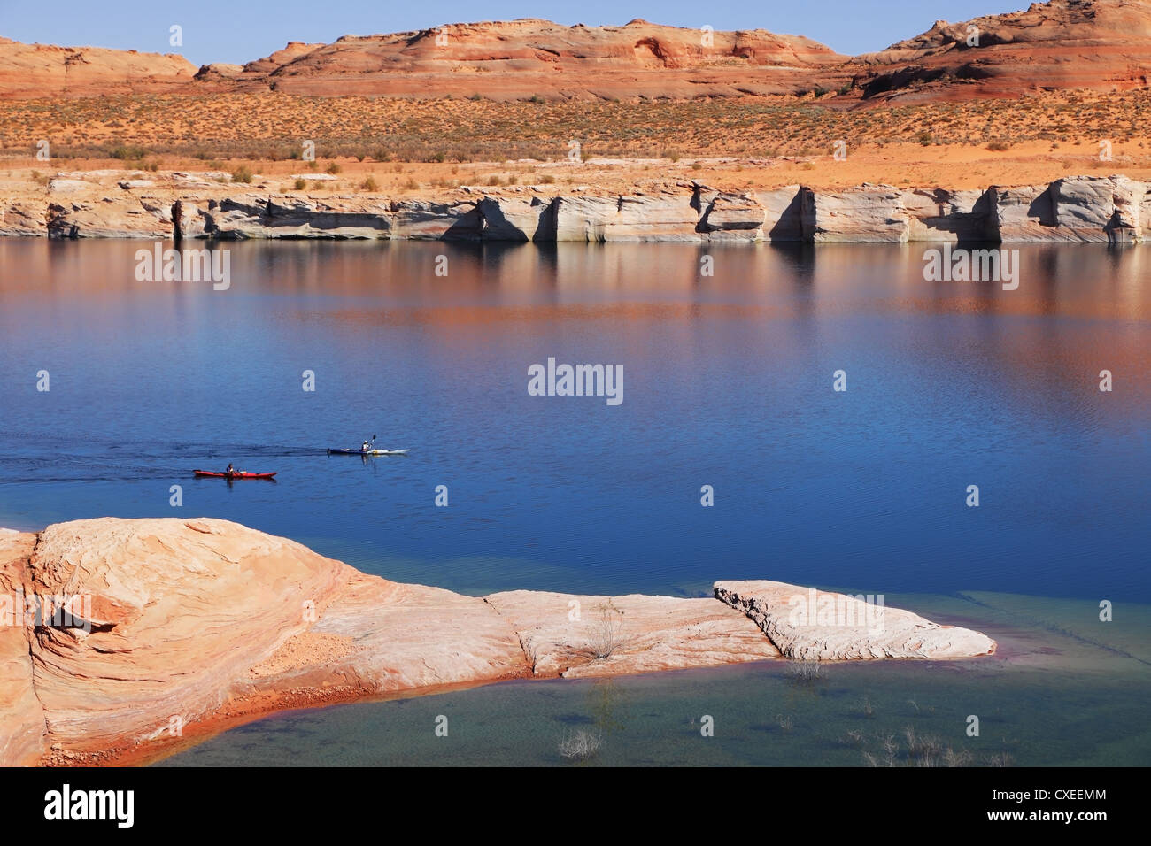 Two boats with oars float in the water Stock Photo - Alamy
