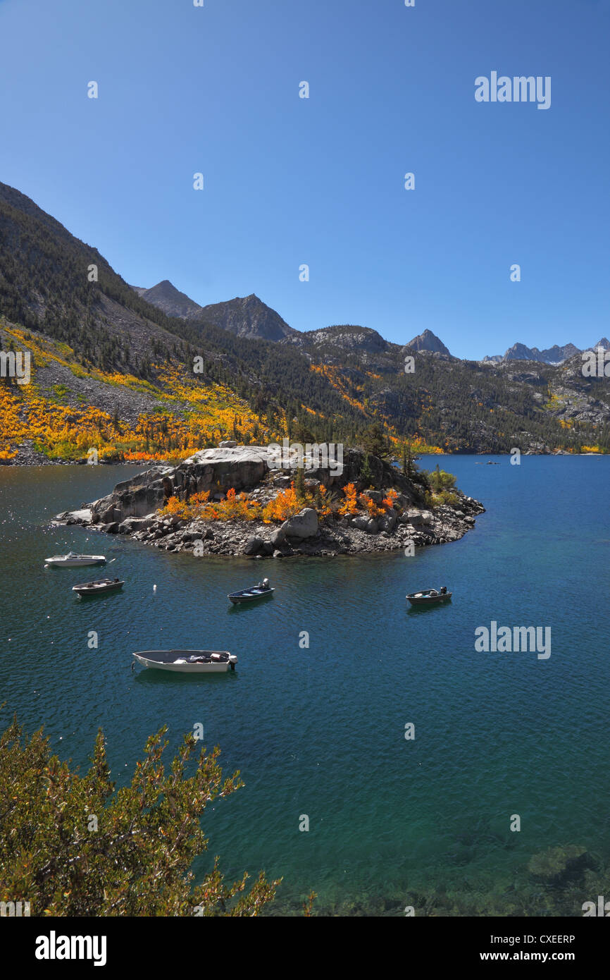 Fishing boats about island Stock Photo - Alamy