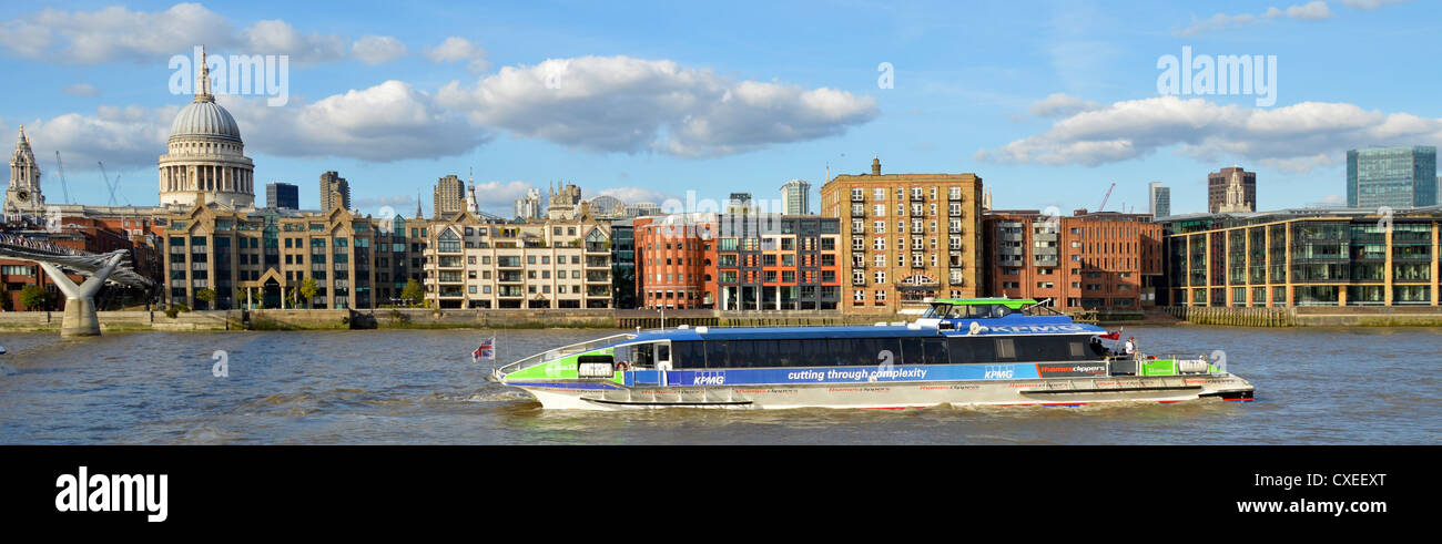 Thames Clipper riverboat commuter and tourist service passing St Pauls ...